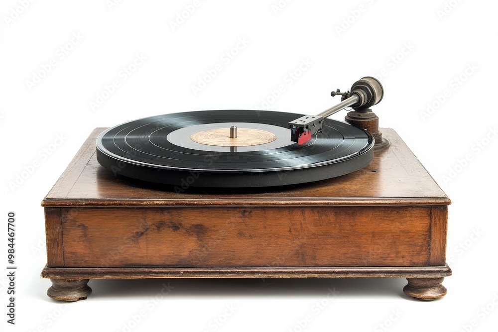 A vintage wooden turntable with a vinyl record playing, showcasing its ...