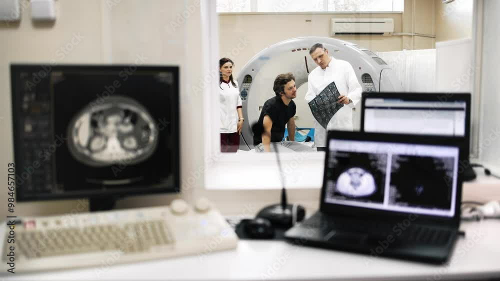 A young patient speaks with a doctor after an MRI procedure. The doctor ...