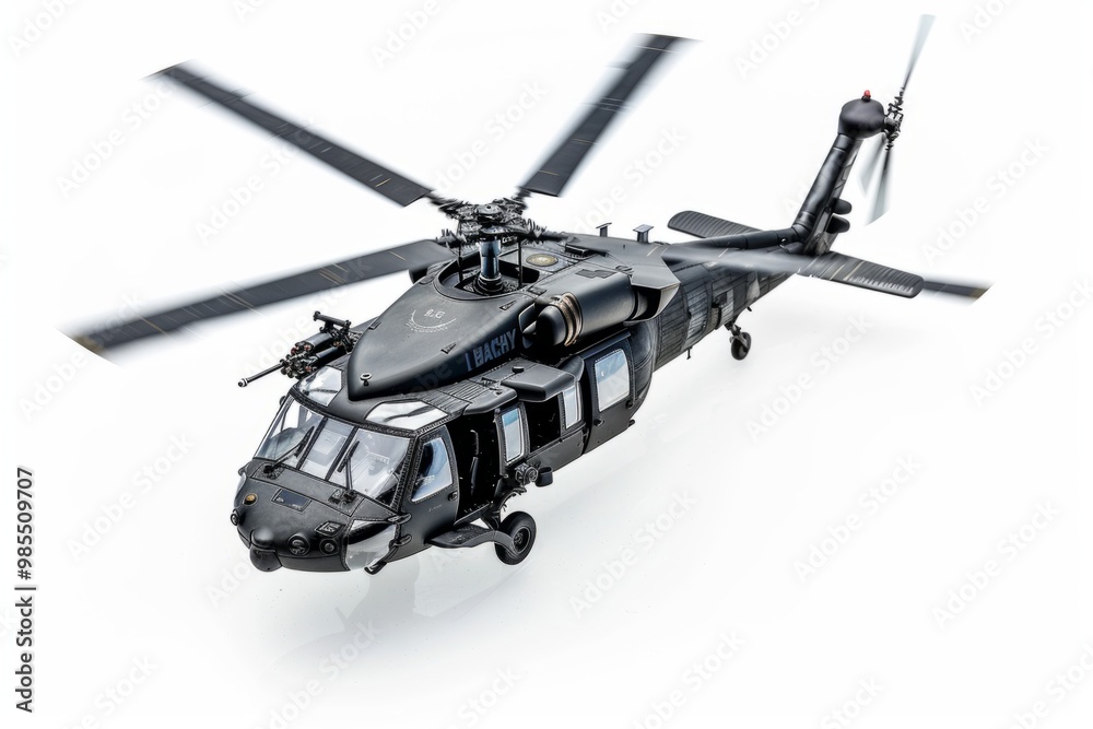 A detailed model of a sleek black helicopter with spinning rotors. This ...