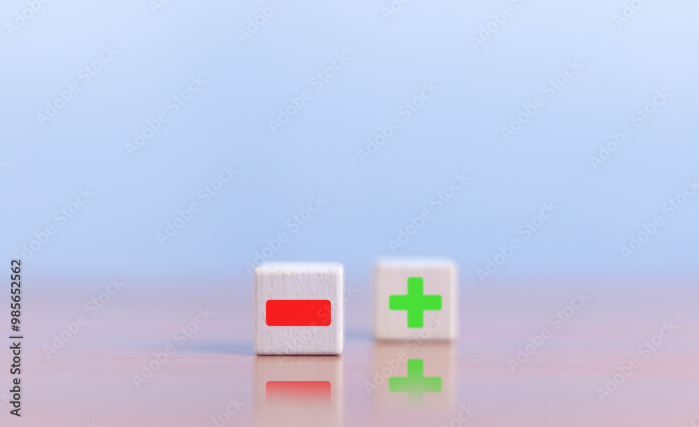 Wooden block shows icons, plus and minus, pros and cons comparison ...