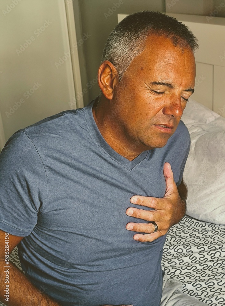 Young adult man suffering from heart attack.Man with chest pain,arm ...