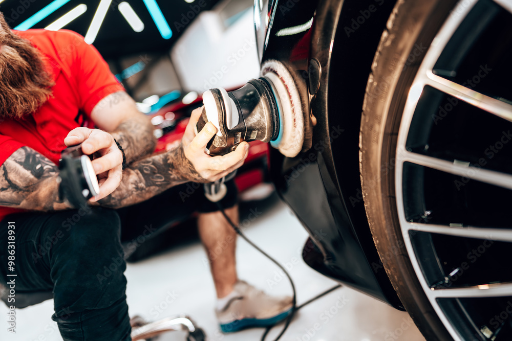 Professional vehicle polishing and detailing service in a modern car ...