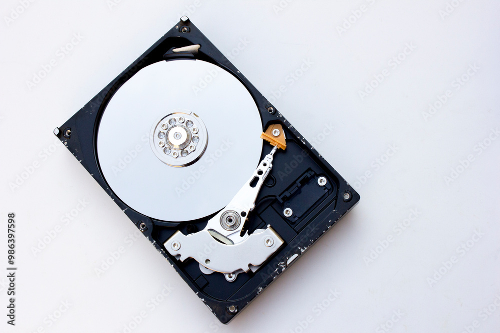 Computer internal hard disk drive with its top case removed to have a ...