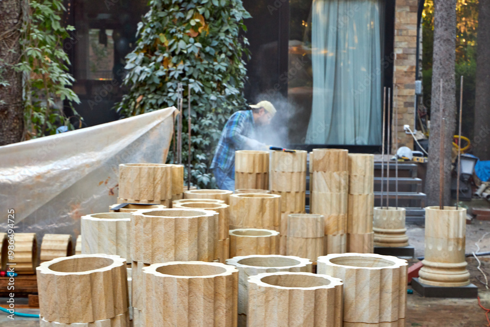 process of assembling natural stone columns for a pergola Stock Photo ...