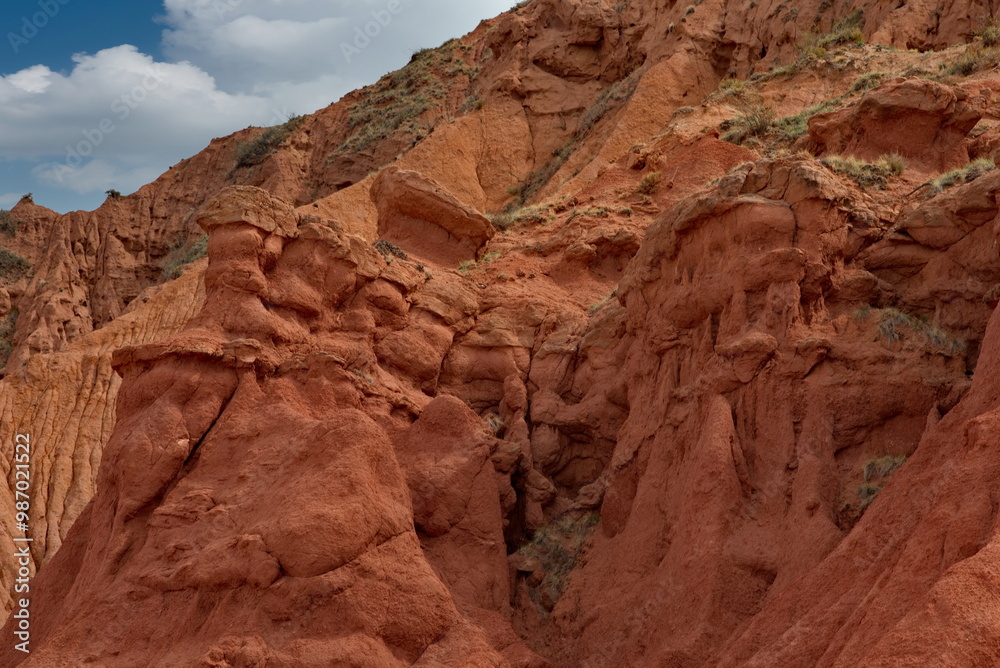 Northern Kyrgyzstan. The unusual texture of red-yellow clay rocks in ...