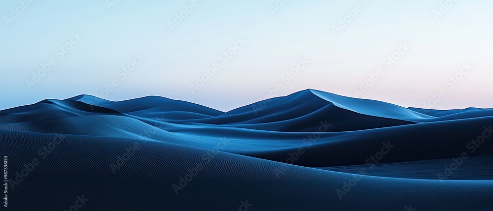 High contrast image of desert dunes at twilight with sharp shadow lines ...