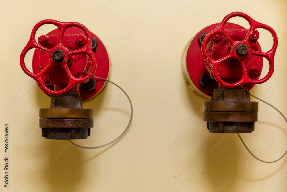 Two red fire hydrants with valves from the ship's fire suppression ...