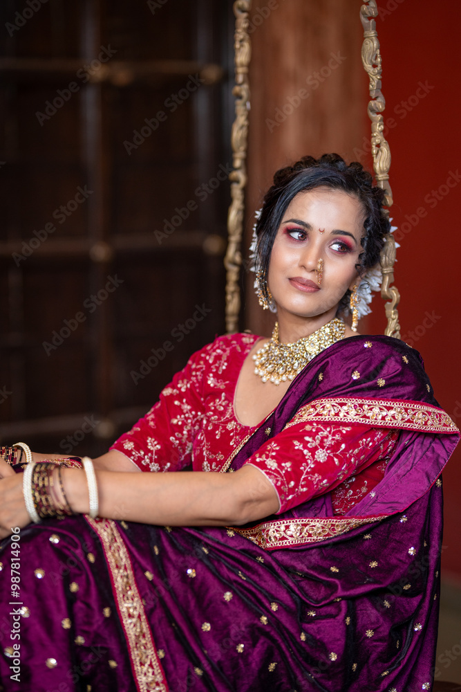 Graceful Composure: A Marathi Woman in Traditional Attire on a Swing ...