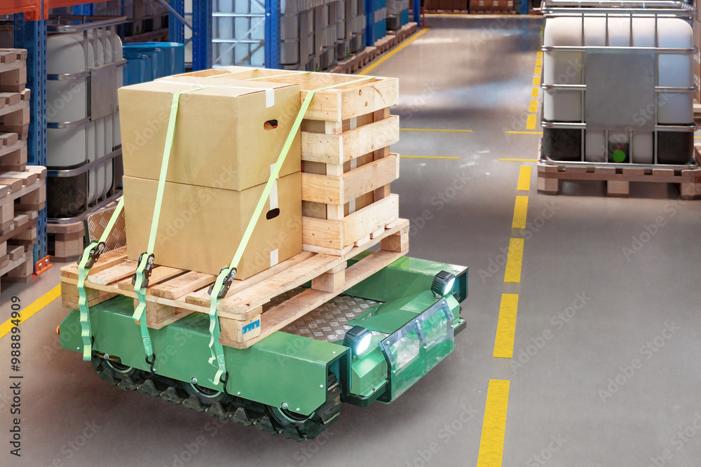 Warehouse robot. Automatic trolley for moving pallets. Warehouse technologies. Robot with boxes ...