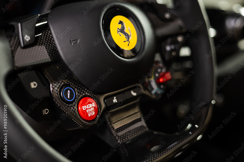 Ferrari. The logo sign of a powerful Ferrari super car. Close up photo ...