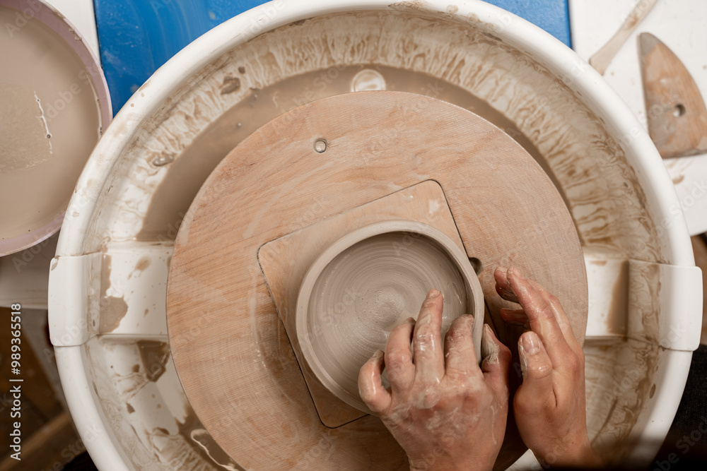 Wheel throwing. Learning how to model clay into different shapes with ...