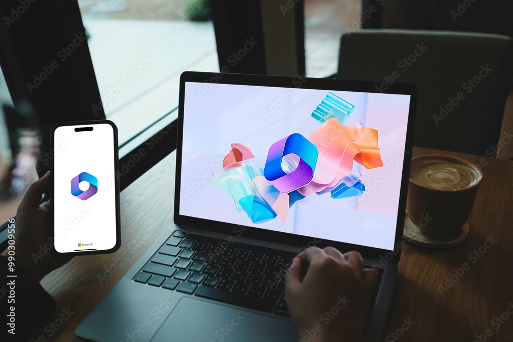 Bangkok. Thailand. SEP 24,2024 :A man useing laptop computer and phone ...