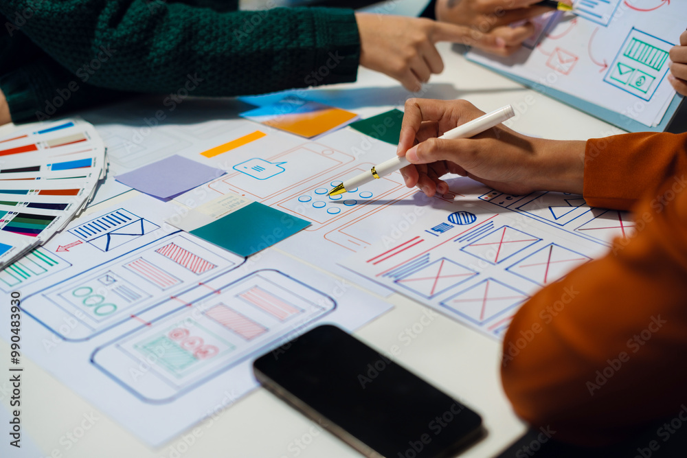 UX developer and ui designer brainstorming about mobile app interface ...