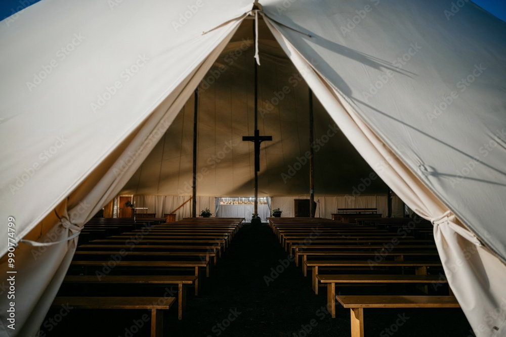 Outdoors white church tent with rows of wooden benches and corridor ...