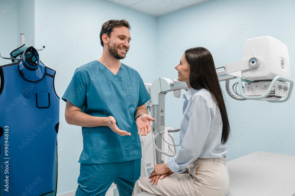 Doctor talking with female patient woman before X-ray scan procedure ...