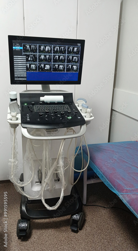 Vertical image of Ultrasound equipment in medical examination room ...