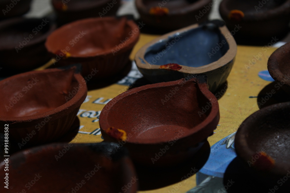 Artistic homemade clay oil lamps or karthikai deepam are ready for ...