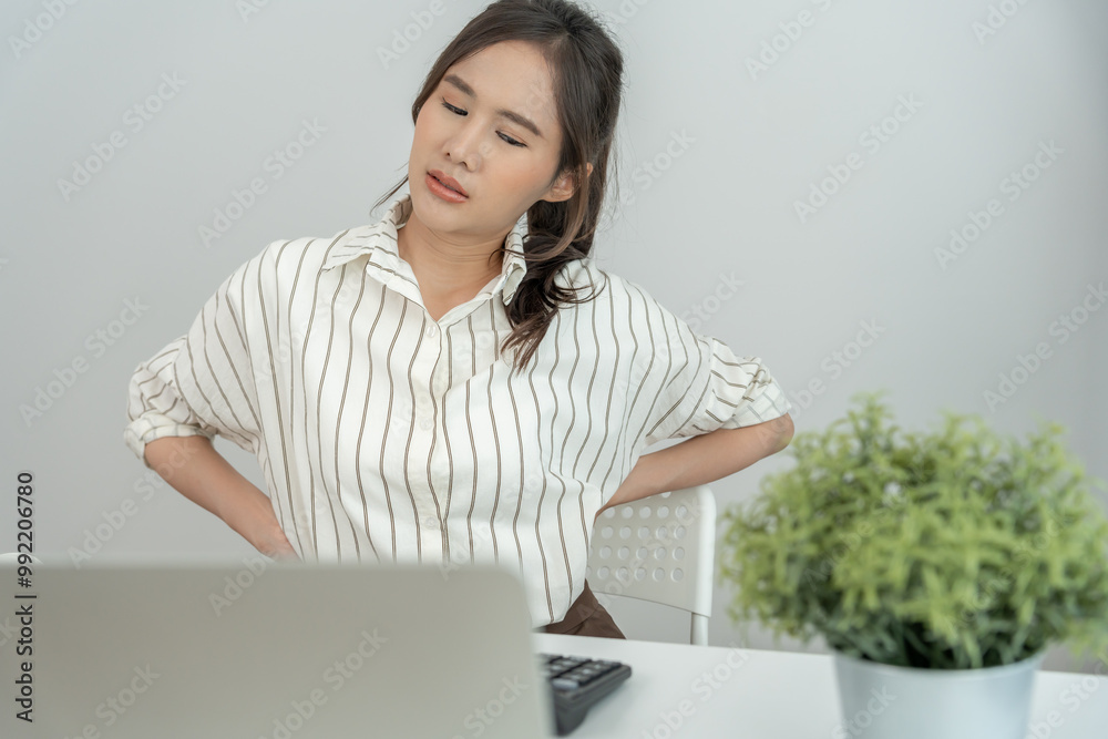 Asia beautiful woman holding her lower back while and suffer from ...
