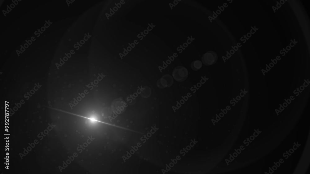 optical light with rays of light burst with lens flare on black ...