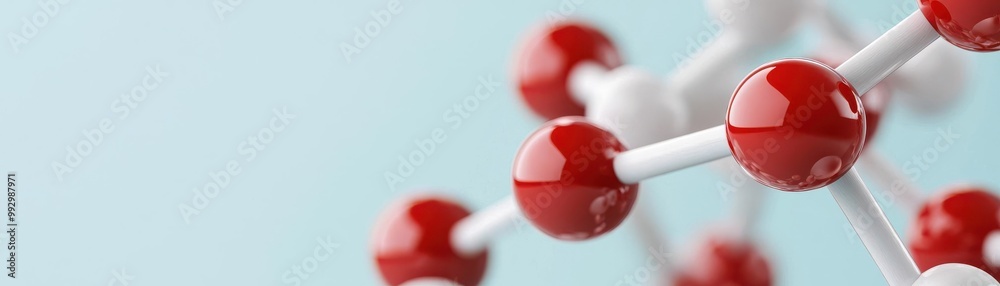 molecular structure model with red and white spheres on a light blue ...