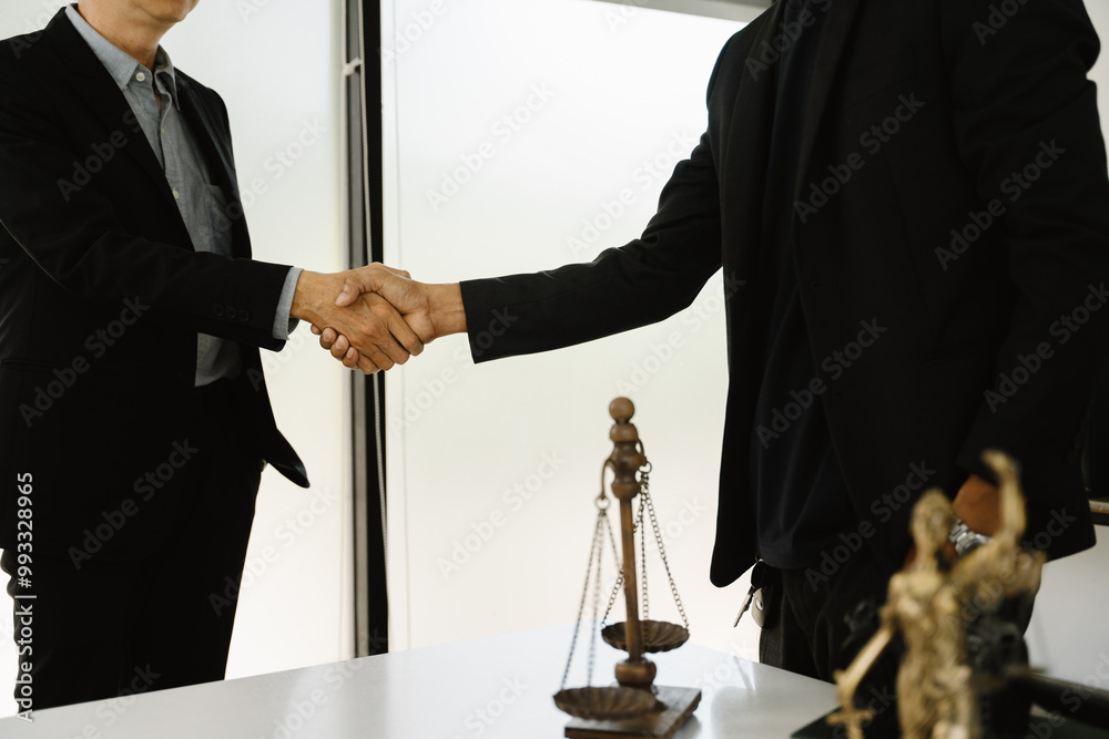 Justice Served: A powerful handshake seals a legal agreement ...