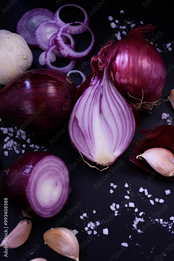 Blue onion cut and whole close-up with garlic and salt. Benefits and ...
