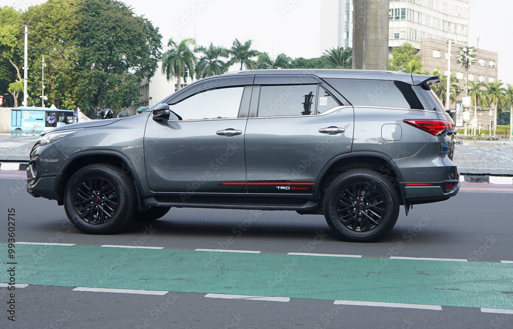 Day Gray color, SUV Toyota Fortuner, drive at comercial area, Bundaran ...