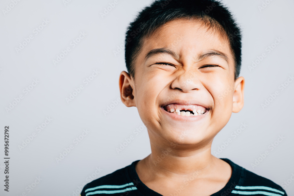 Smiling kid gap in upper teeth showing lost tooth. Child isolated ...
