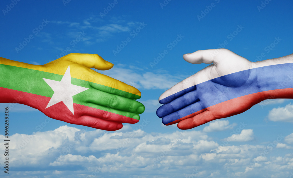 Russian Federation and Myanmar country handshaking with flags ...