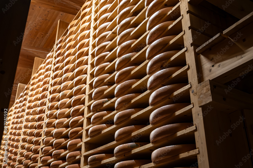 Aging rooms with shelves in cheese caves, central location for aging of ...