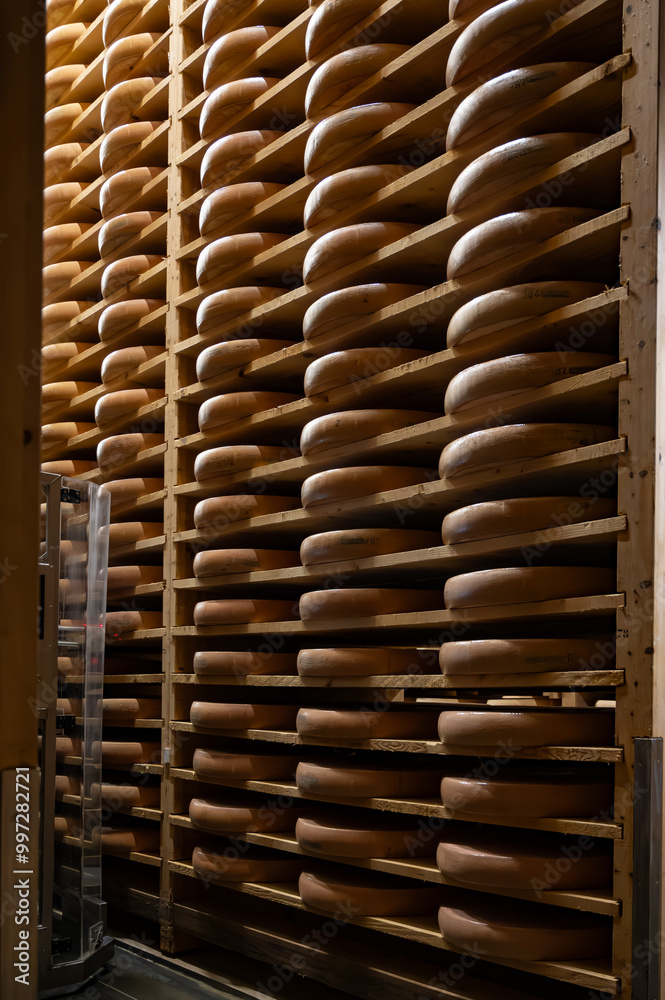 Aging rooms with shelves in cheese caves, central location for aging of ...