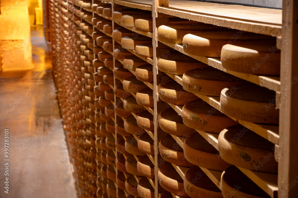 Aging rooms with shelves in cheese caves, central location for aging of ...