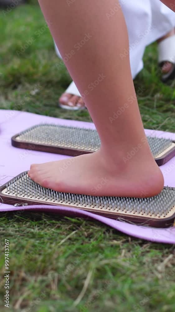 Standing on sadhu board, process of barefoot standing on nails therapy ...