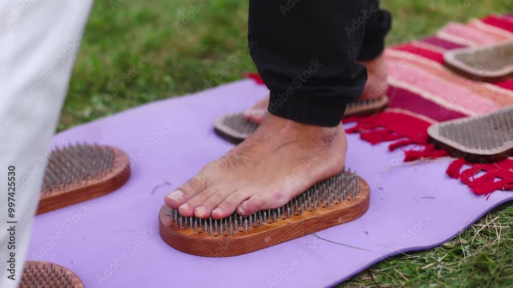 Standing on sadhu board, process of barefoot standing on nails therapy ...