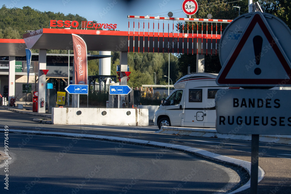France, 10 August 2024 : ESSO Express gas station with van and road ...