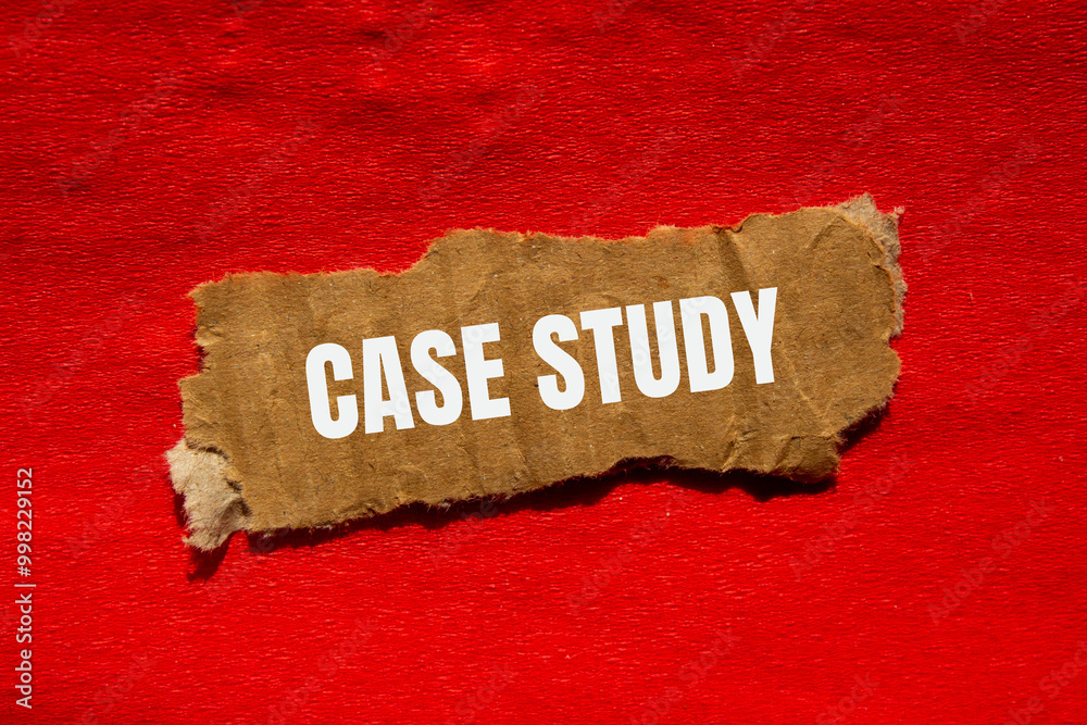 Case study message written on ripped torn cardbaord paper piece with ...