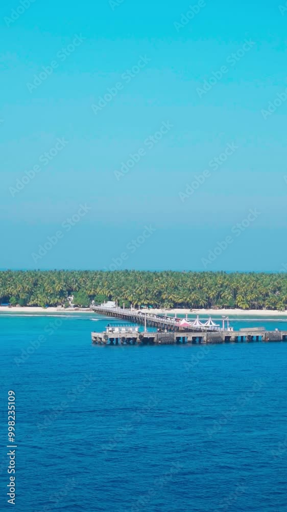 Vertical video of Blue water of ocean and cement jetty at Agatti Island ...