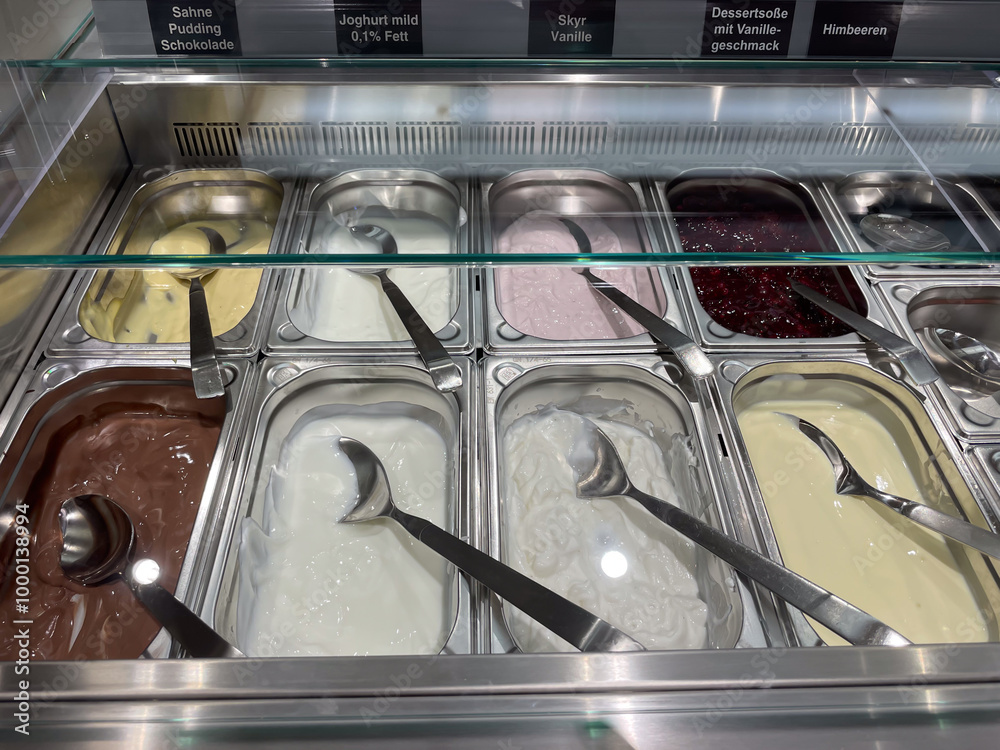 Display case with different flavors of pudding. The body is made of ...