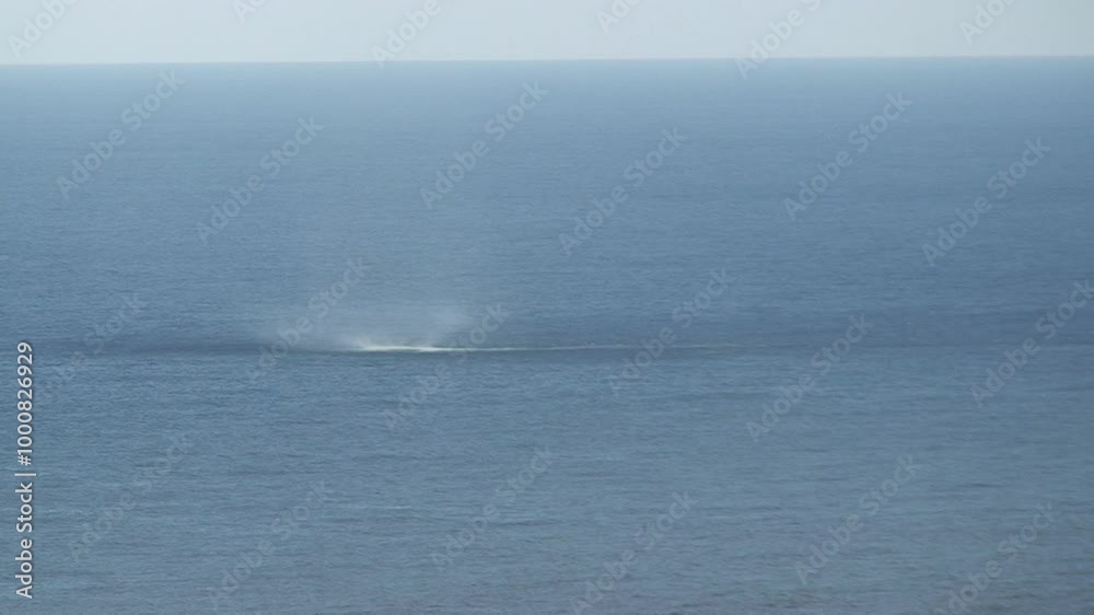 View of the early stage of a waterspout forming at the ocean surface ...