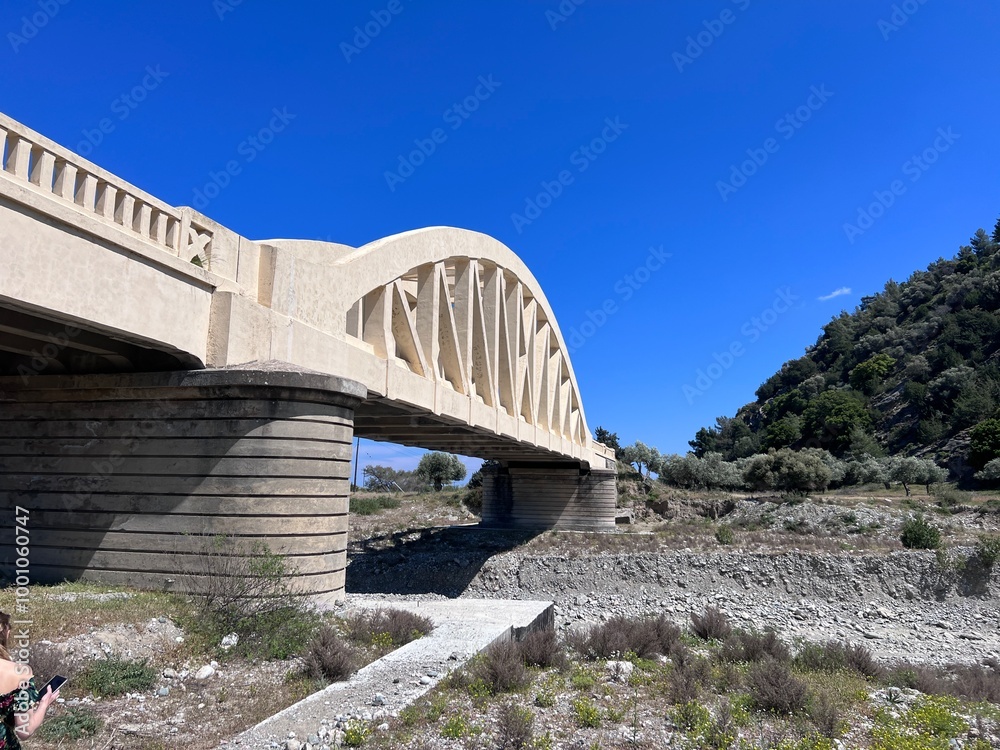 Medieval stone bridge Italian Arch Bridge Rhodes. With dryly river ...