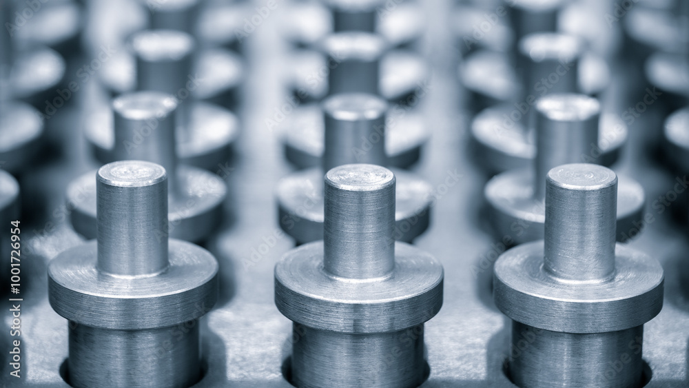 row metal pins are lined up in a row. pins are all the same size and ...