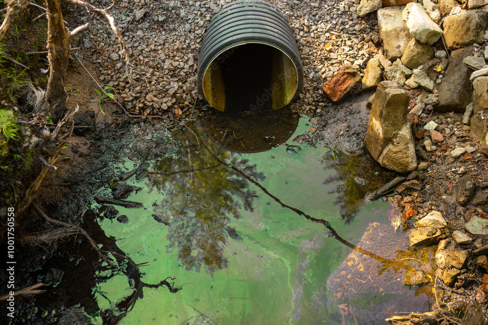 Toxic waste flows out through the sewer pipe.Water pollution by waste ...