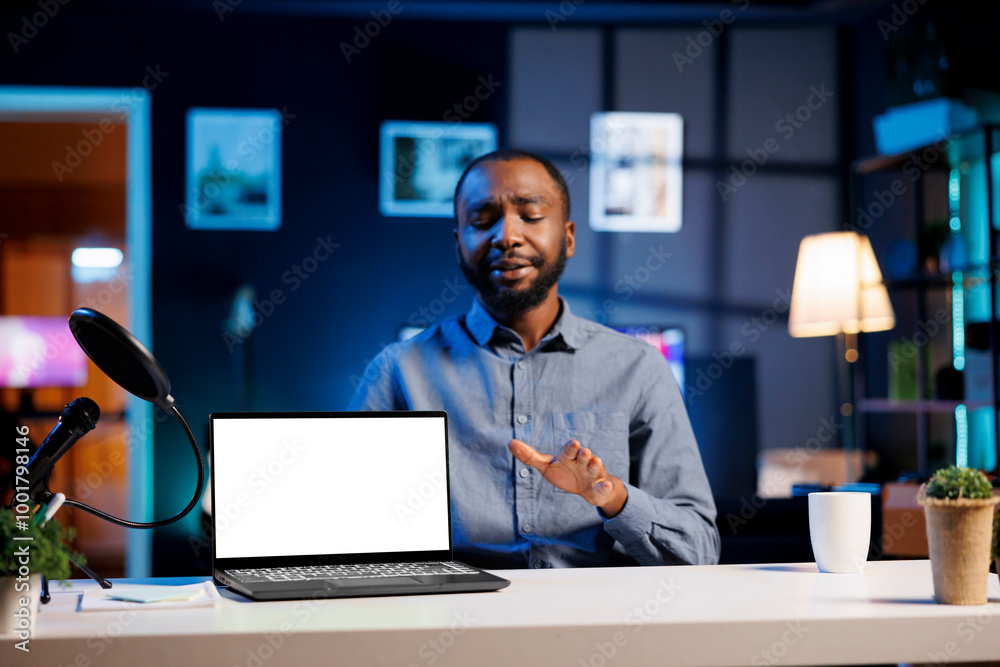 African american reviewer looking at mockup laptop, unsure how to rate ...