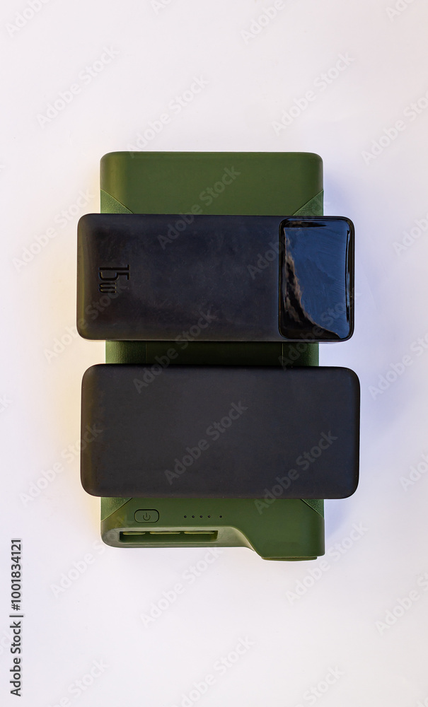 Several different portable devices for charging electronic gadgets ...