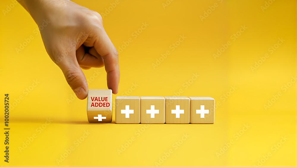 Value add concept. Hand place wooden cube with plus sign on yellow ...