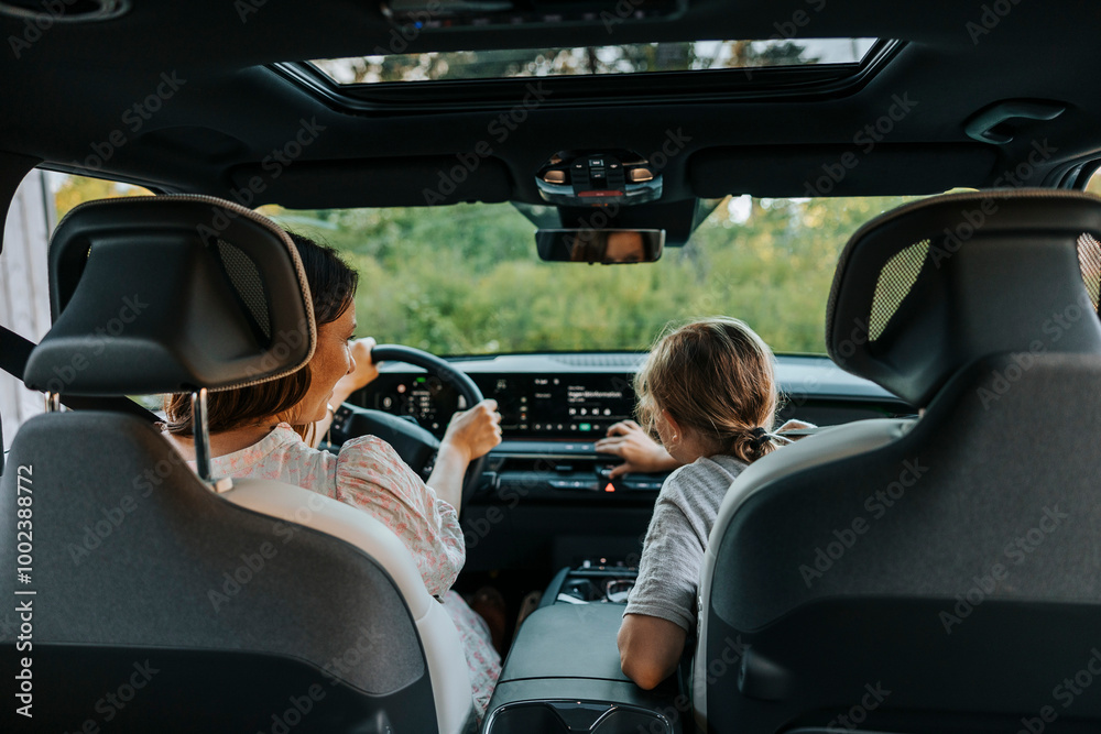 Rear view of woman and son traveling in car during road trip Stock ...
