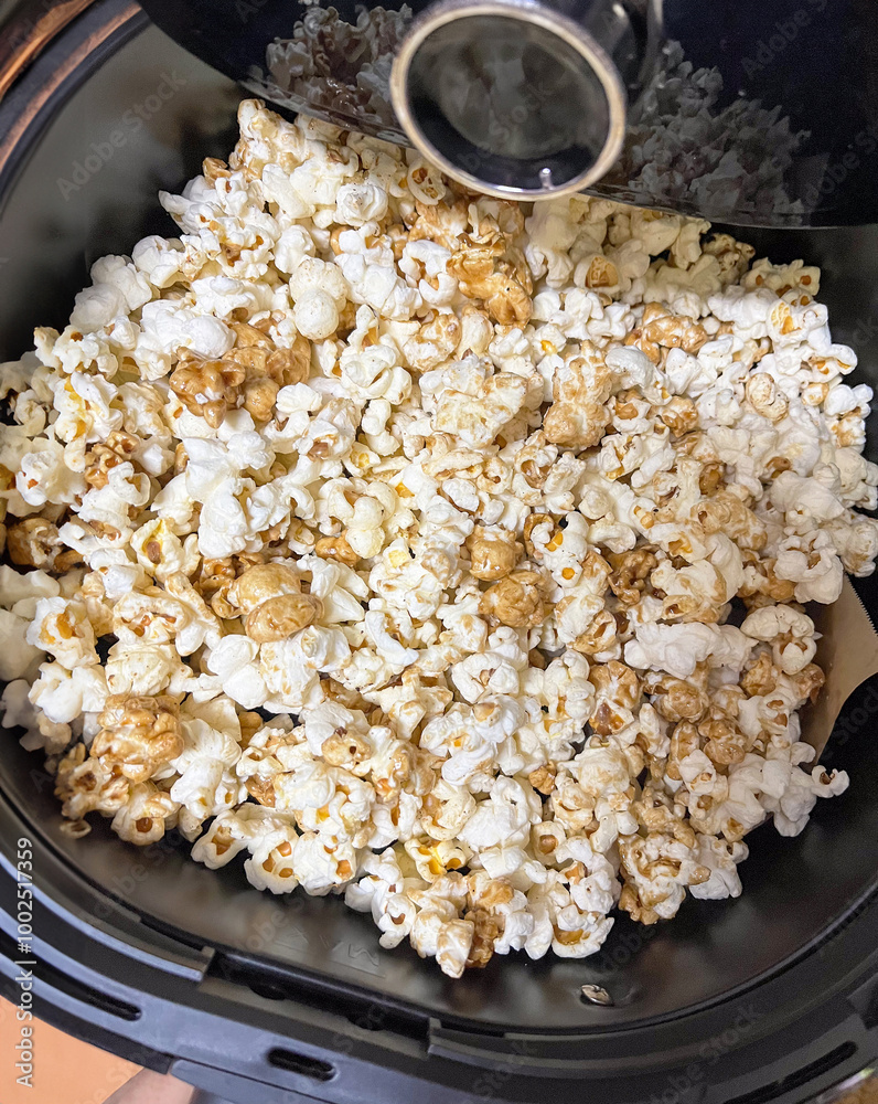 Freshly popped popcorn cooked in air fryer, perfect for movie night or ...
