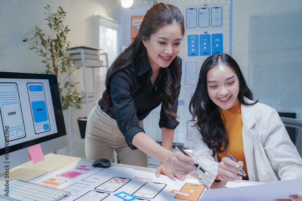 Photo And Art Print Two Asian Women Collaborating As Ui Ux Designers In A Modern Office Creating