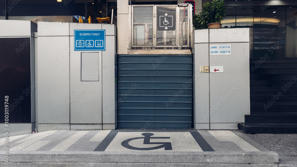 Accessible Elevator with sign. Disabled persons lift near modern ...
