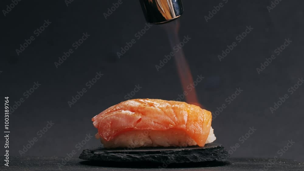 Chef cooking Sashimi Nigiri Platter with flambe fire, japanese sushi ...
